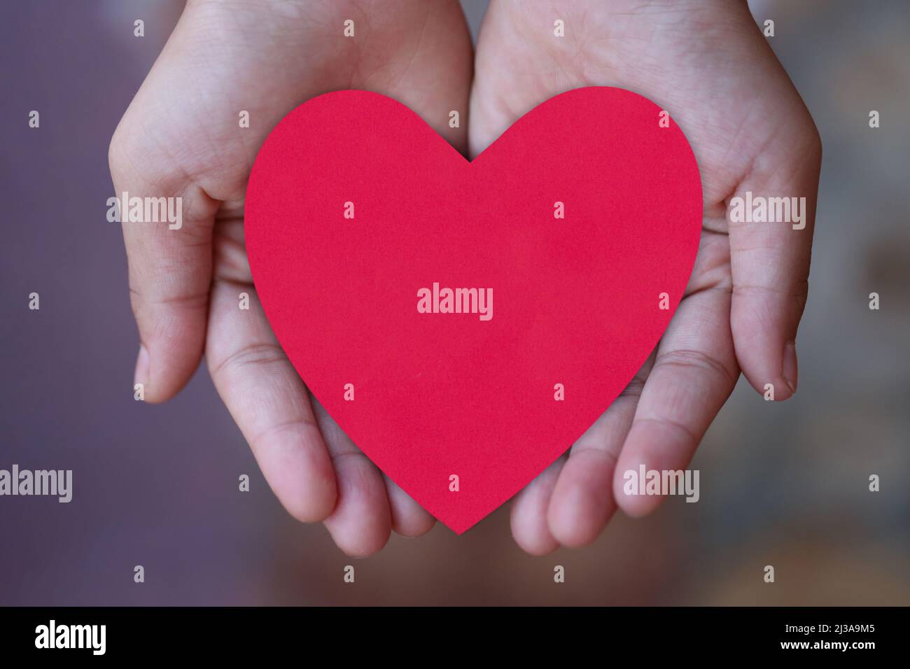 Hand offering heart symbol hi-res stock photography and images - Alamy