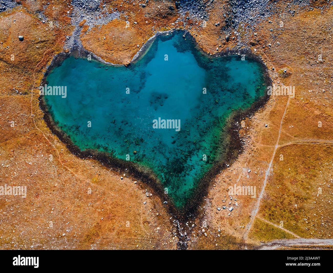 An aerial view of The Herzsee (Heart Lake) in bright sunlight in ...