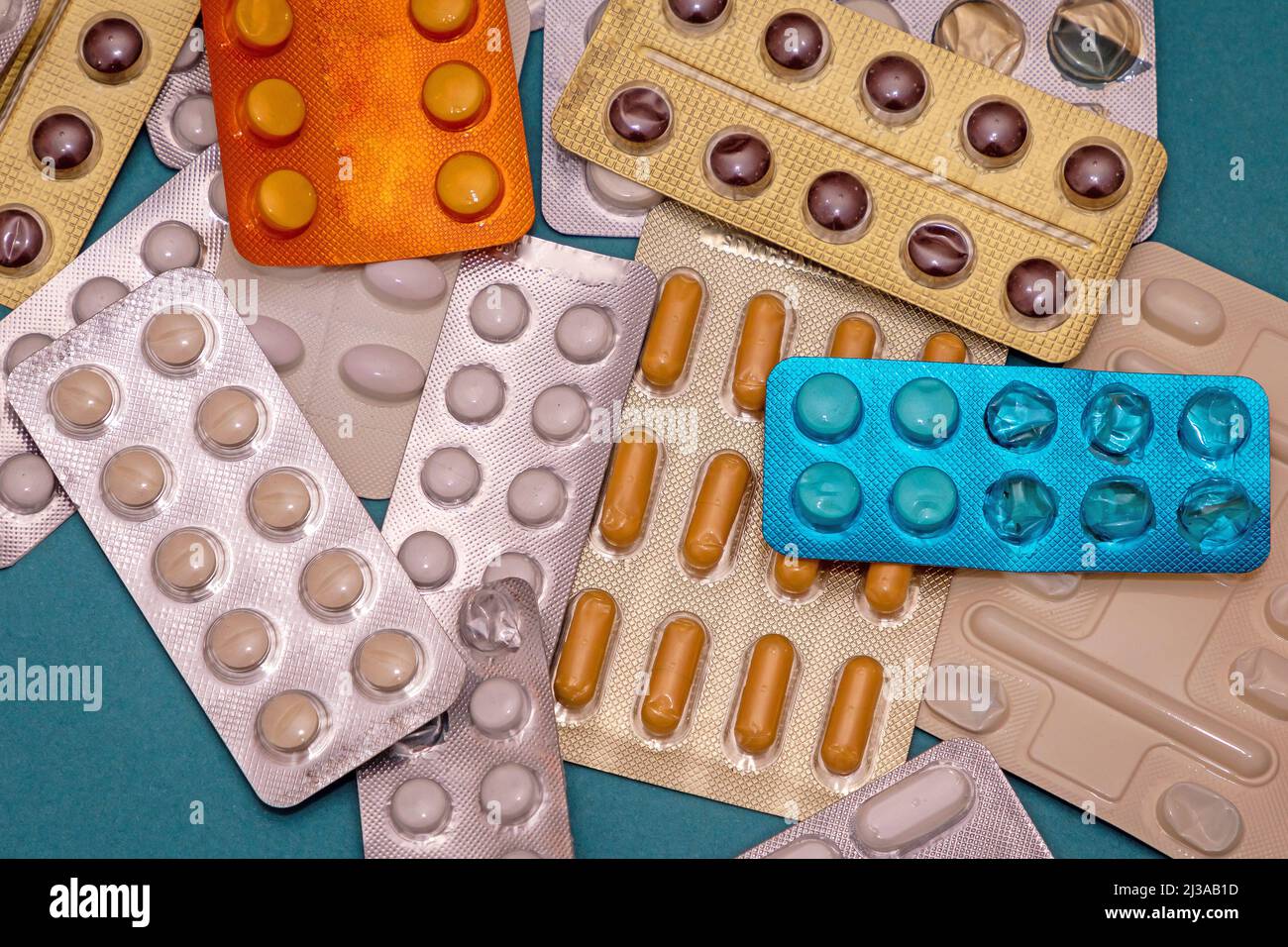 Large pile of colorful prescription pills inside blisters used and new ...