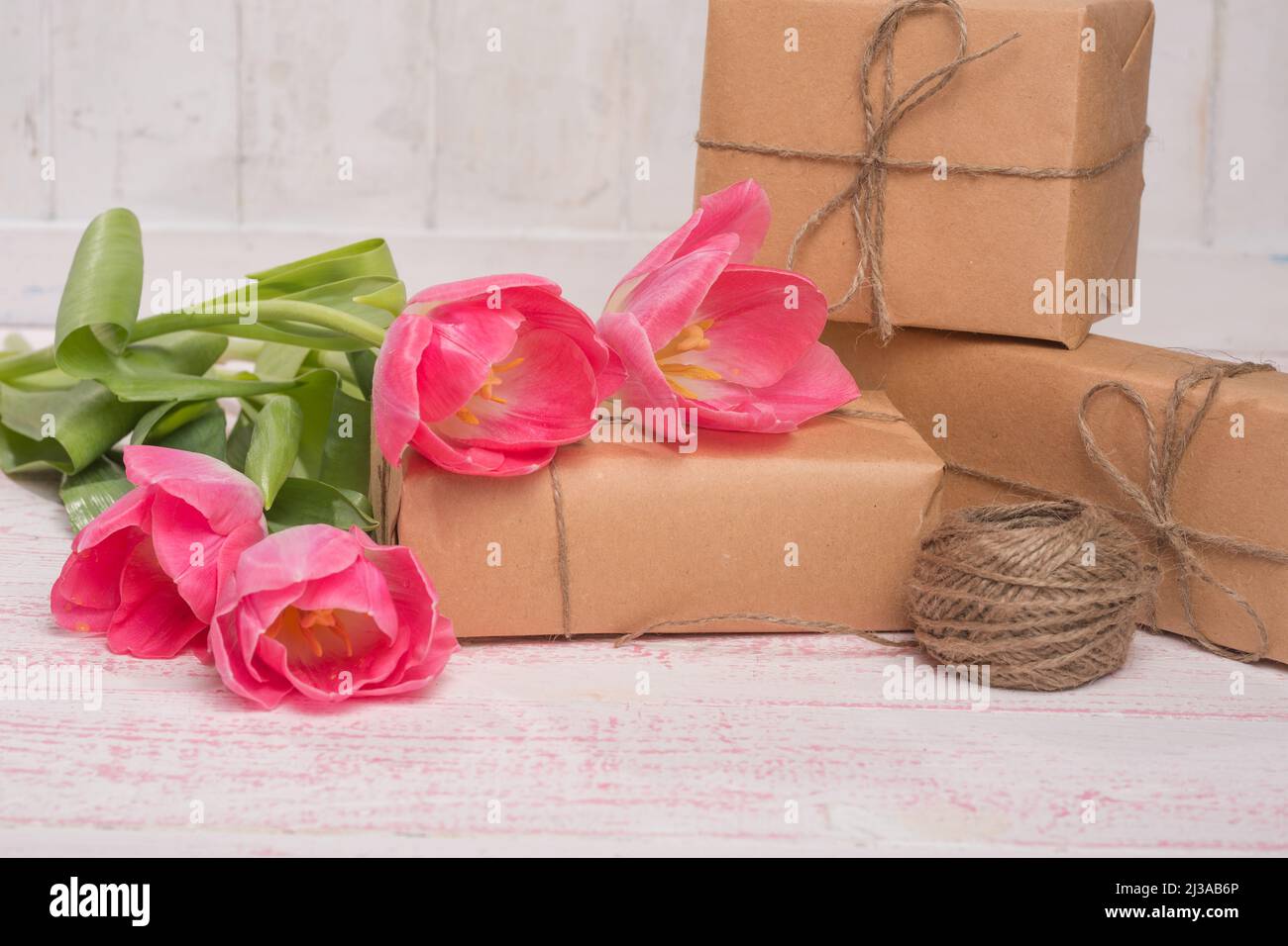tulips and gifts on a paper texture Stock Photo - Alamy