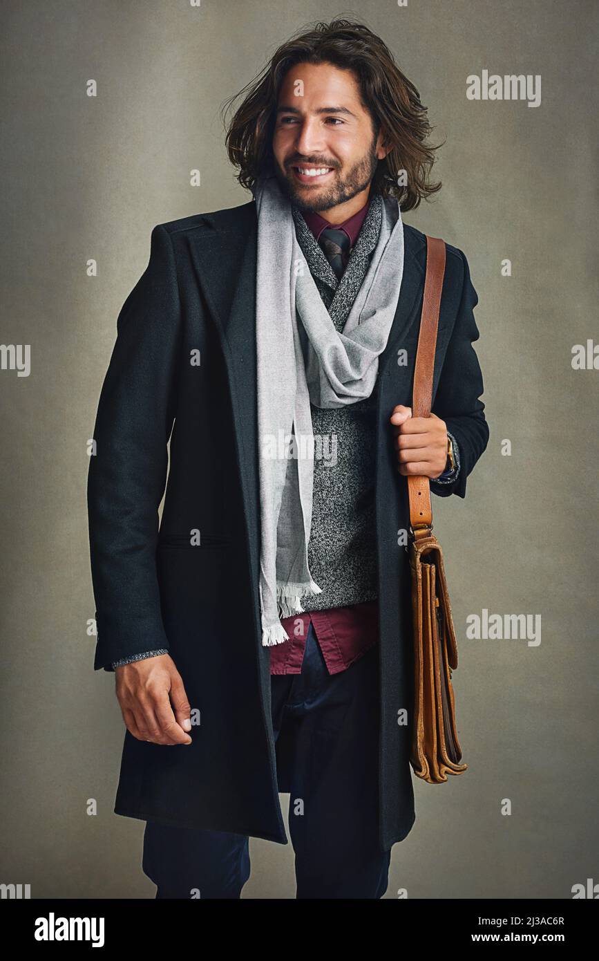Men can dress up too. Shot of a stylishly dressed man posing with a ...