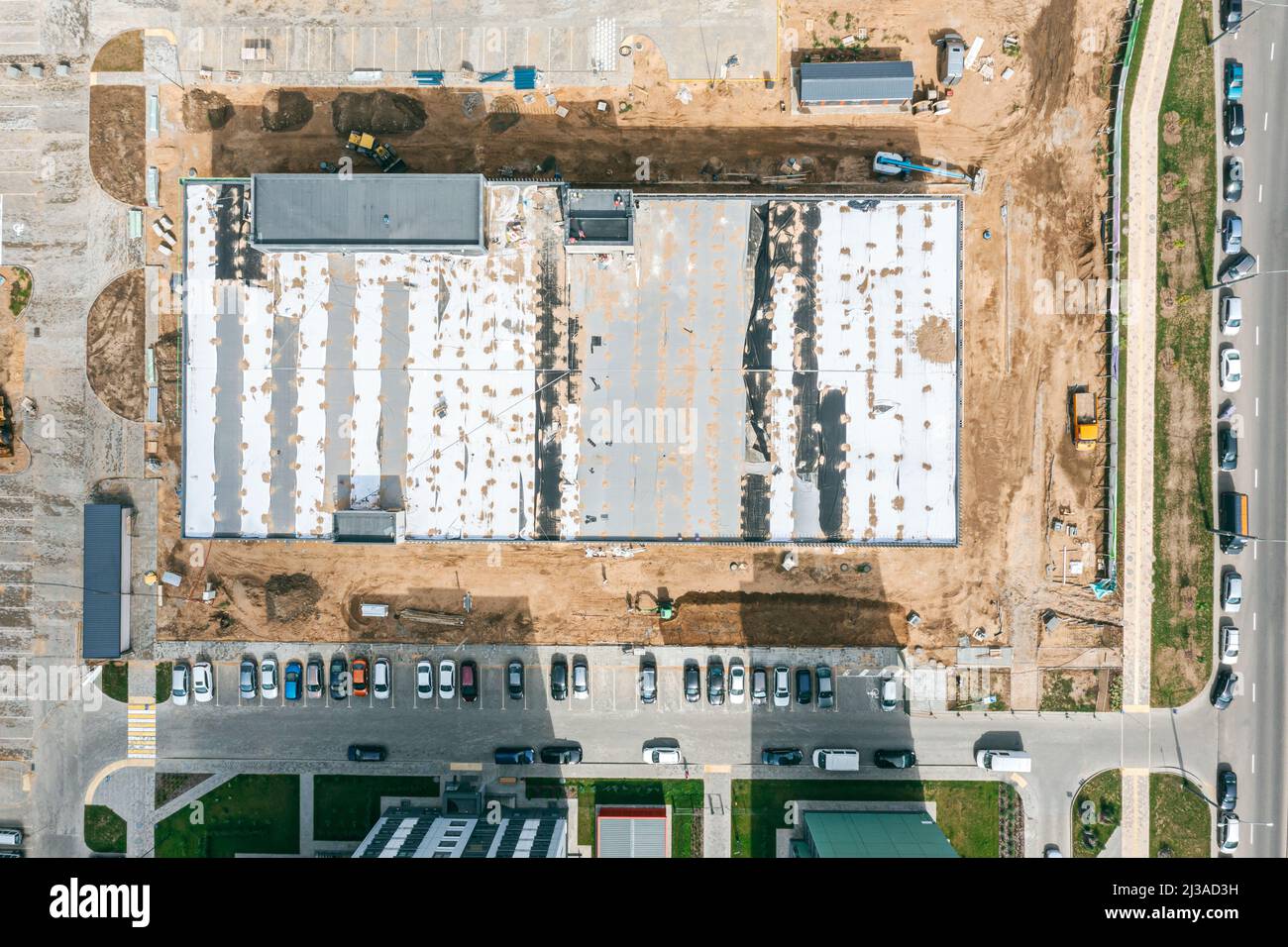 aerial top view of new parking garage under construction in city ...