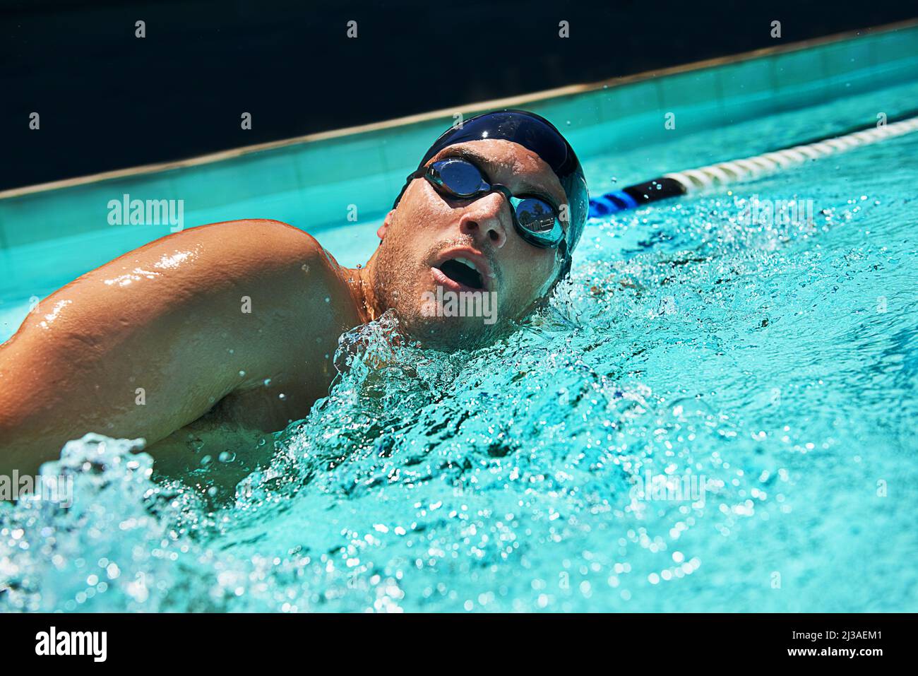 Refreshing exercise. A swimmer in a pool Stock Photo - Alamy