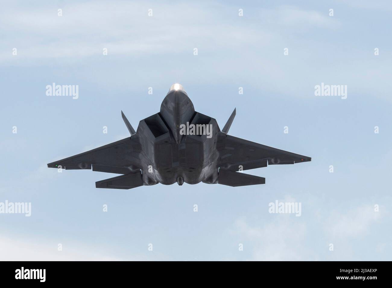 A U.S. Air Force F-22 Raptor assigned to the 3rd Wing flies over Joint ...