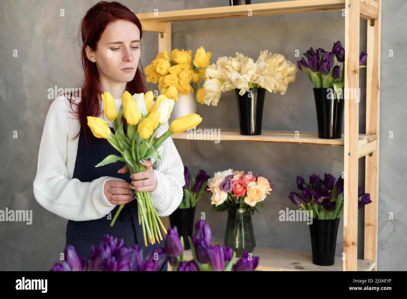 Florist woman works makes bouquet hi-res stock photography and images ...