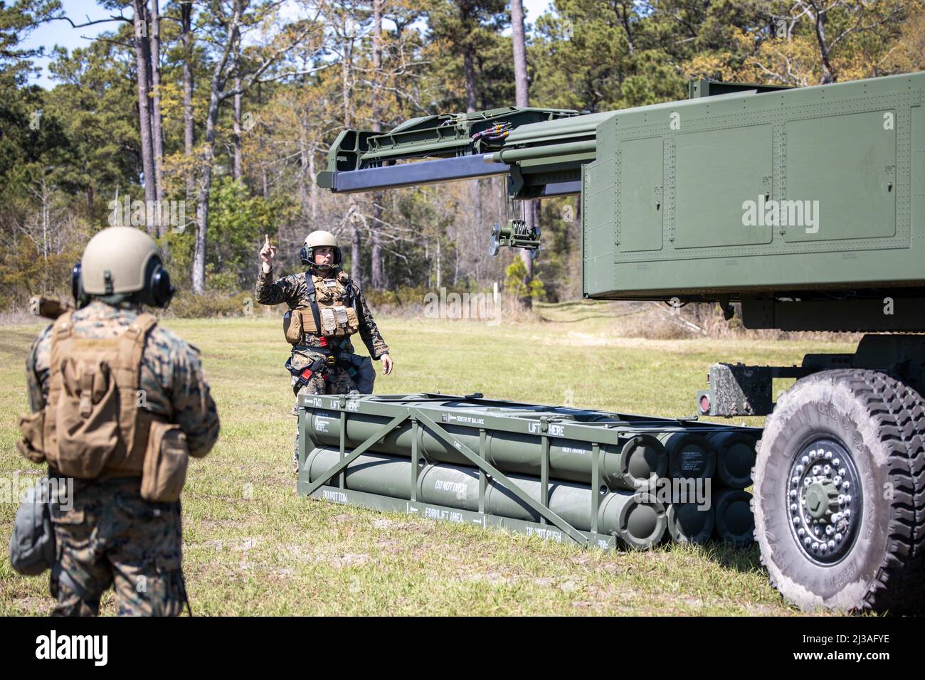 U.S. Marines with 10th Marine Regiment load a reduced range practice ...
