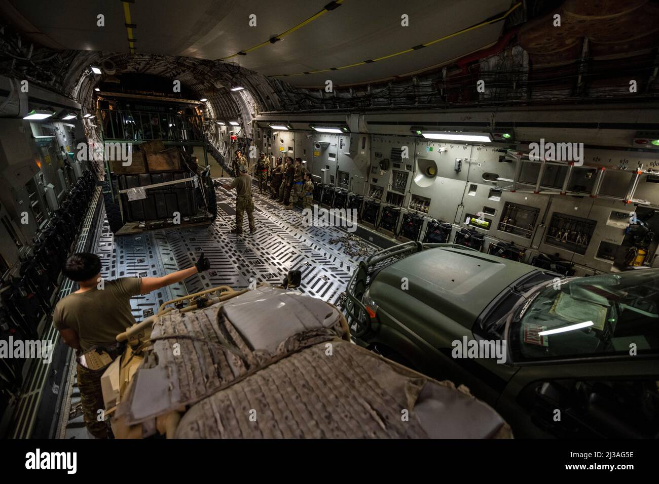 U.S. Airmen from the 60th Aerial Port Squadron ramp services and 8th ...
