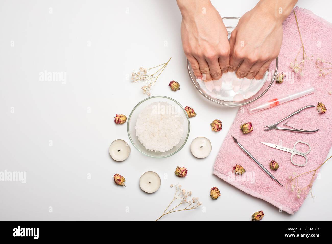 Manicure - the girl herself does, watching the nails with the help of a ...