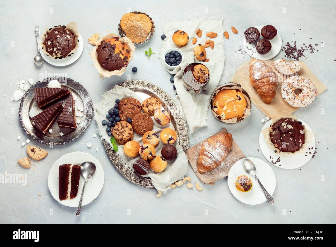 Dessert table with all kinds snacks on light background. Candy bar ...