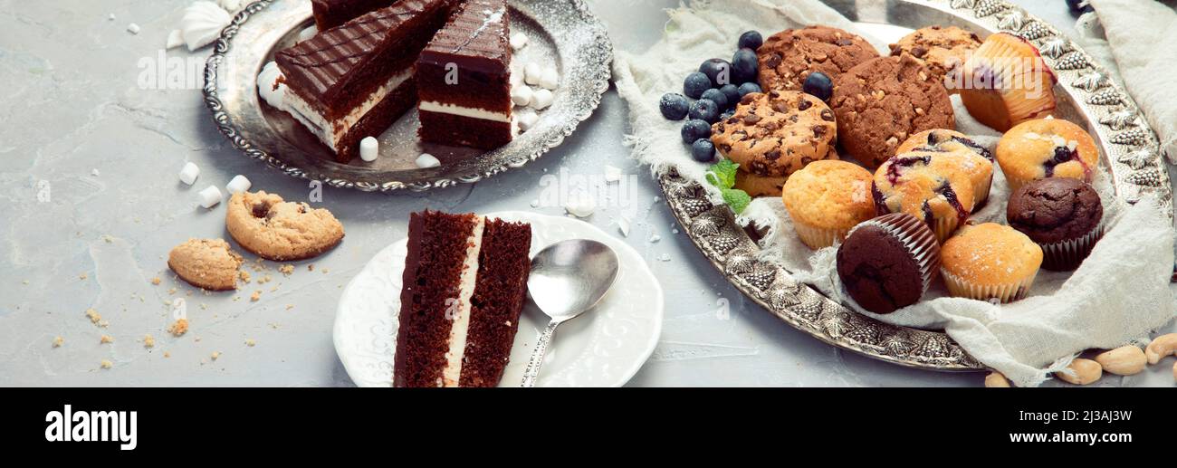 Dessert table with all kinds snacks on light background. Candy bar ...