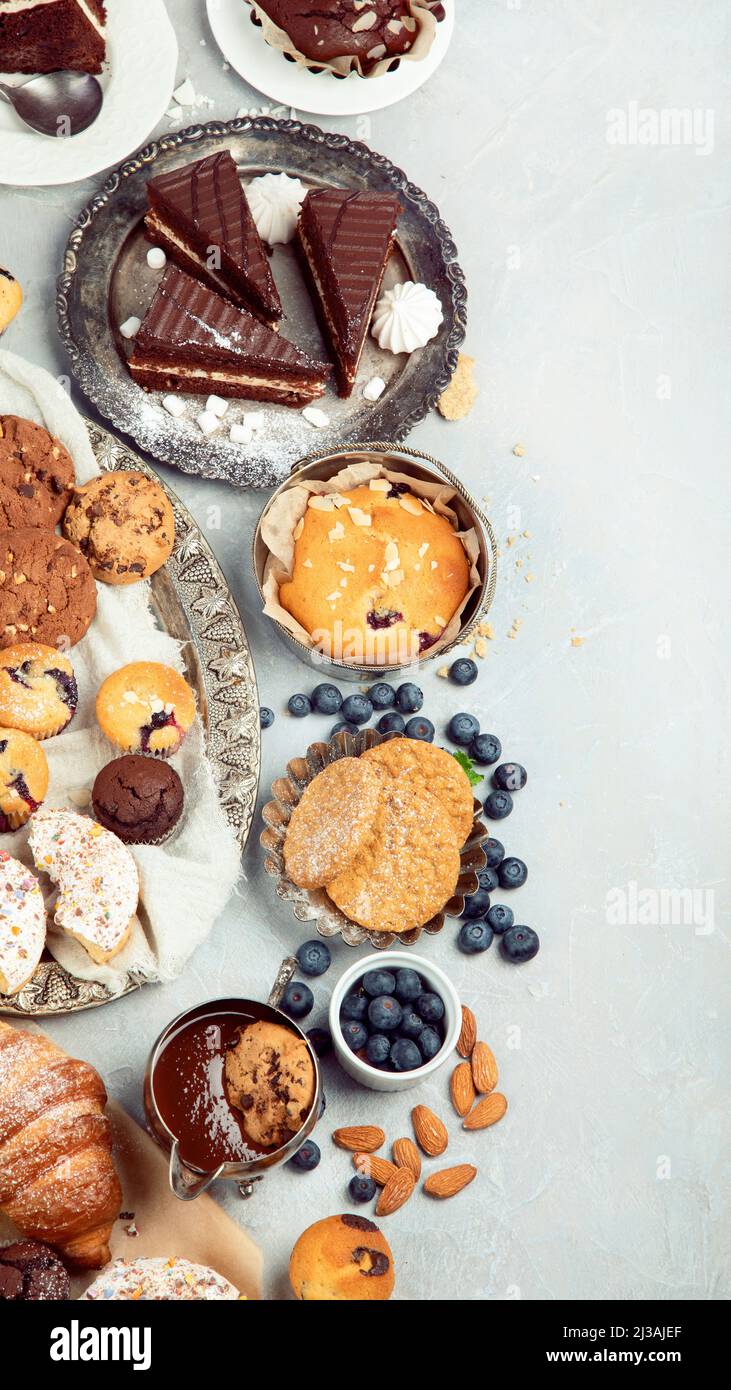 Dessert table with all kinds snacks on light background. Candy bar ...