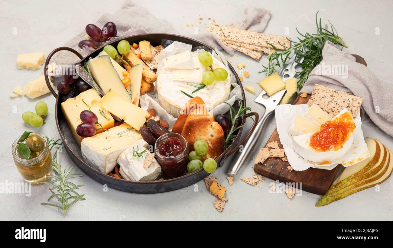 Cheese assortment on light background. Gourmet appetizers on tray ...
