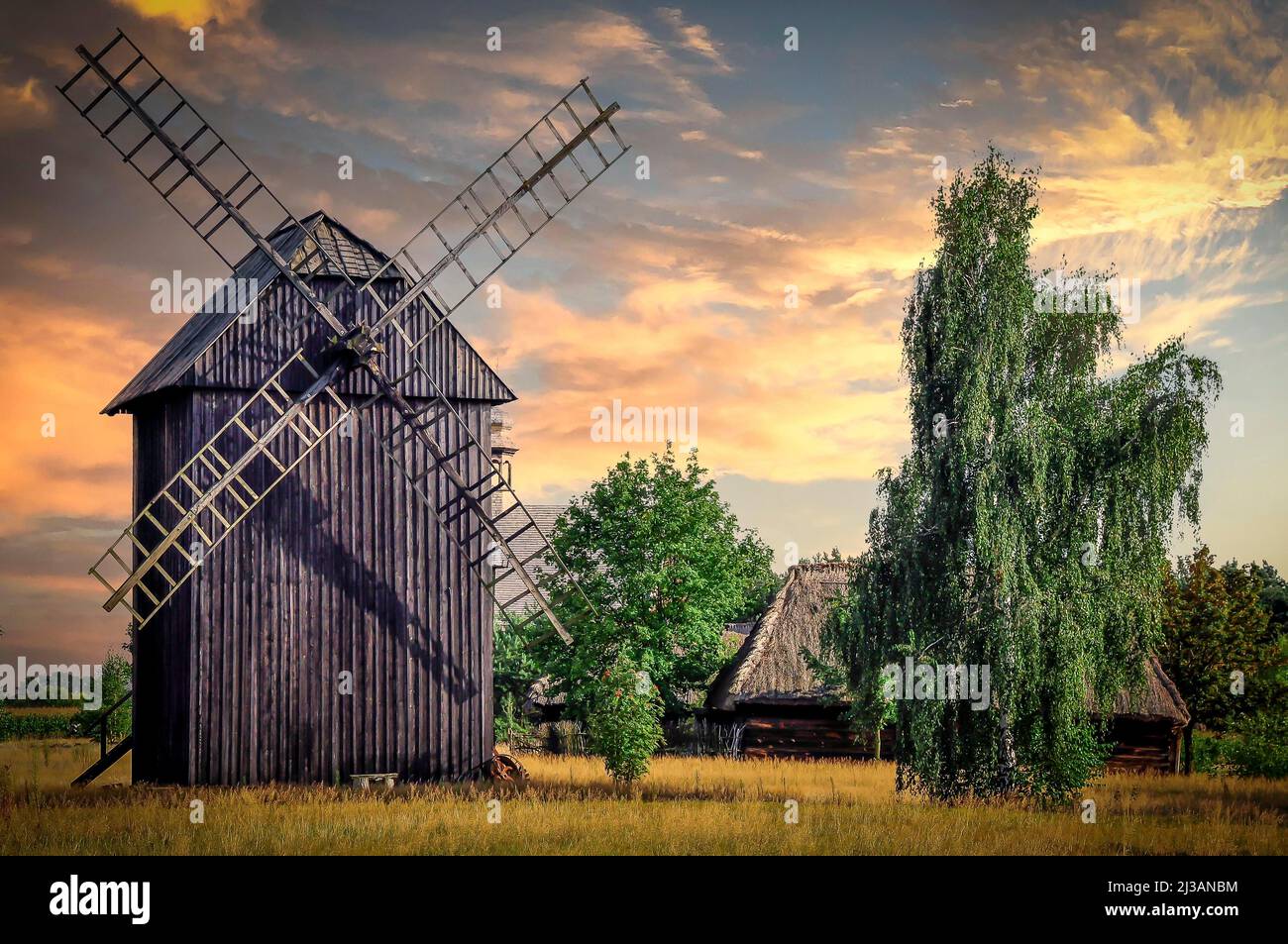 Windmill next to a country cottage, Poland Stock Photo - Alamy