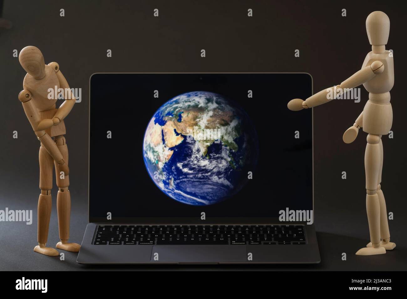 Mannequins are watching the globe on the computer, symbolic image Stock ...