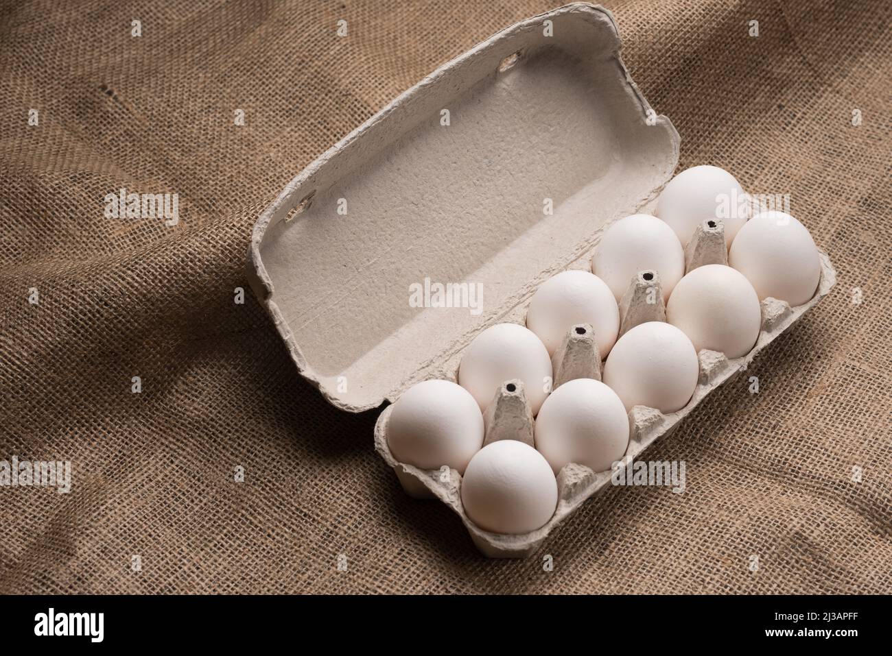 eggs in box on fabric texture Stock Photo - Alamy