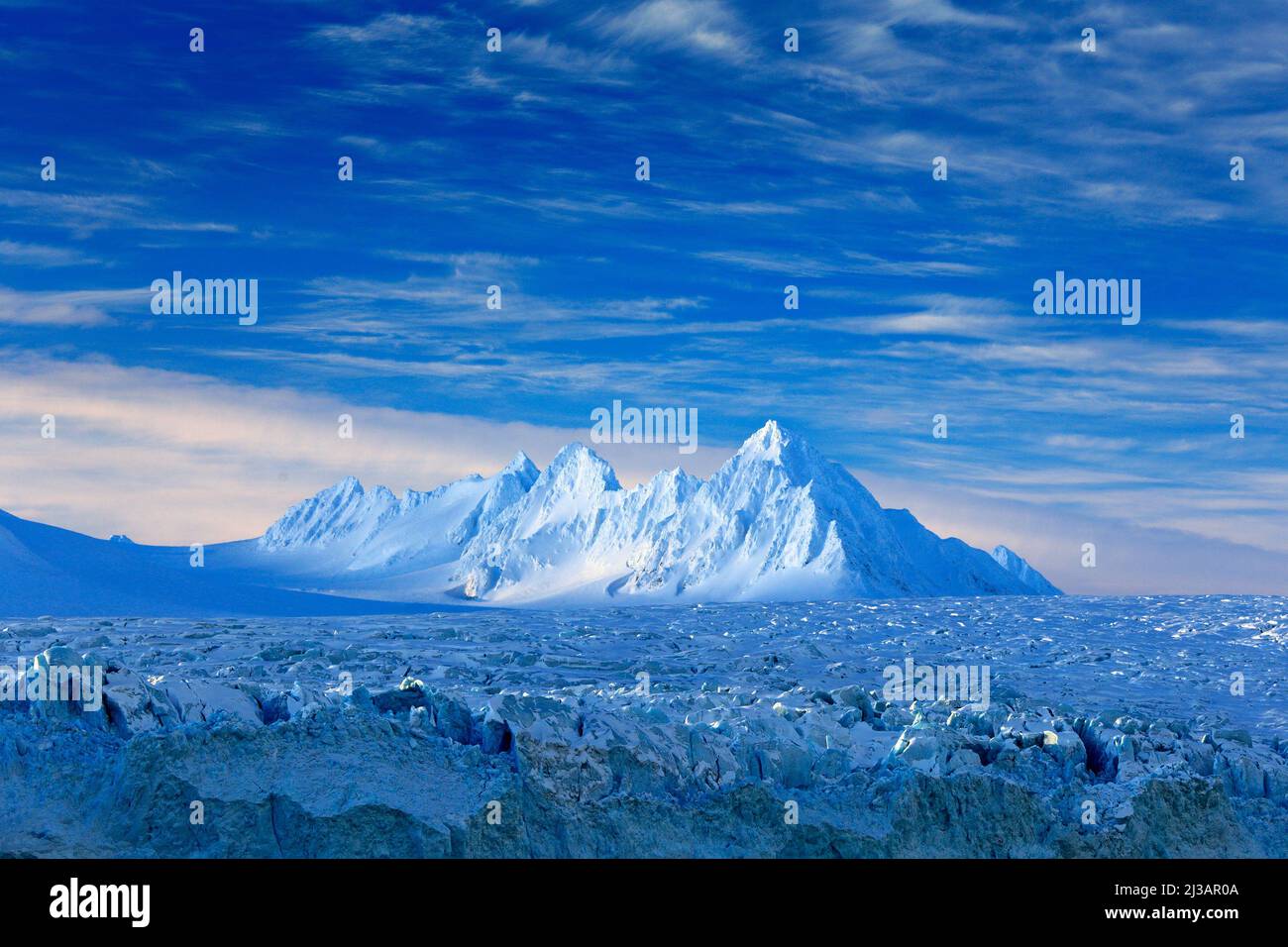 Land of ice. Travelling in Arctic Norway. White snowy mountain, blue ...