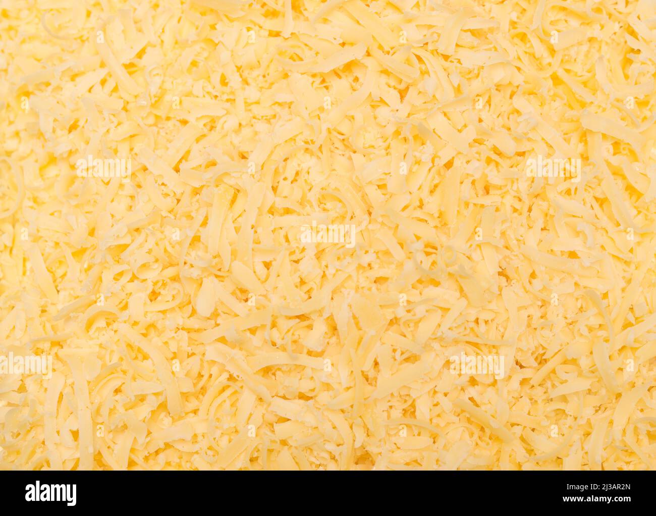 Grated cheese as a background Stock Photo - Alamy
