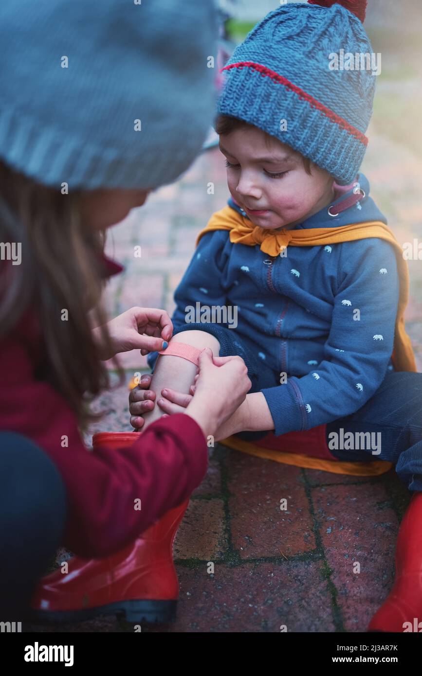 Boy putting on a plaster hi-res stock photography and images - Alamy