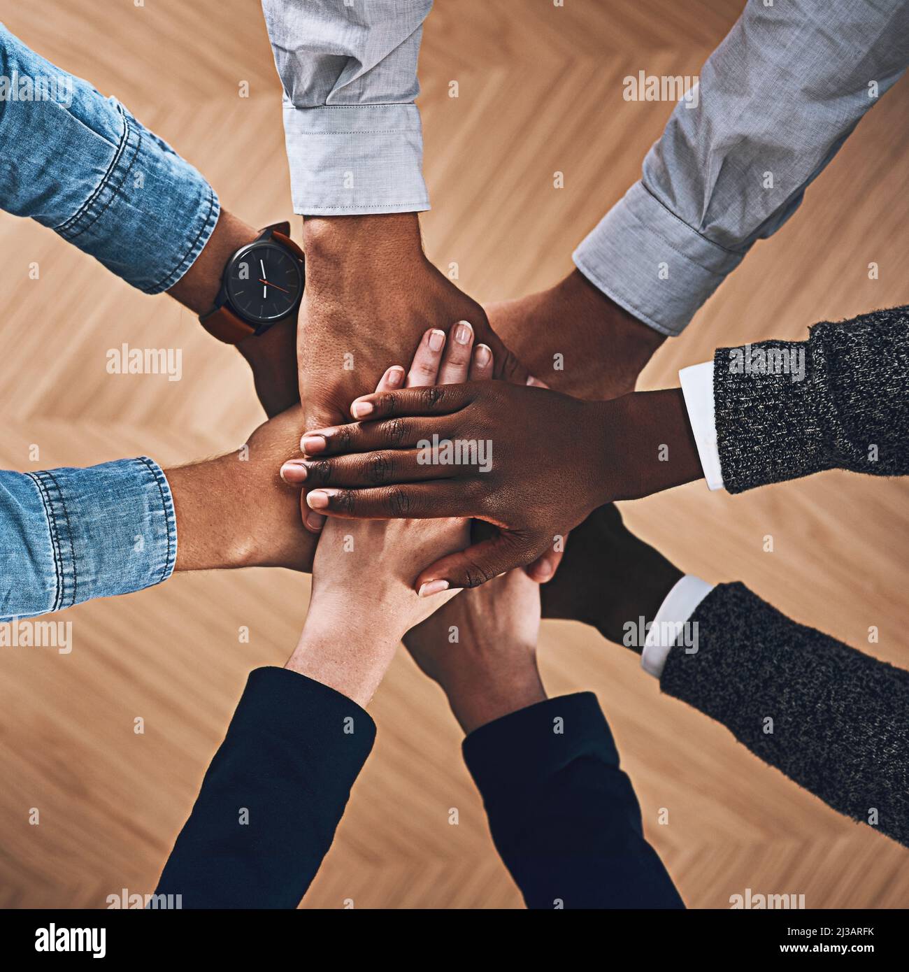 Building a spirit of collaboration and cooperation. High angle shot of a group of unidentifiable ...