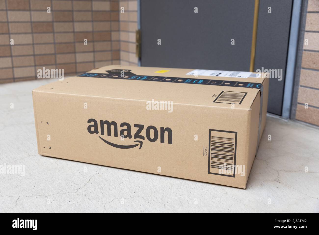 April 7, 2022, Tokyo, Japan: Amazon package in front of a door. Credit ...