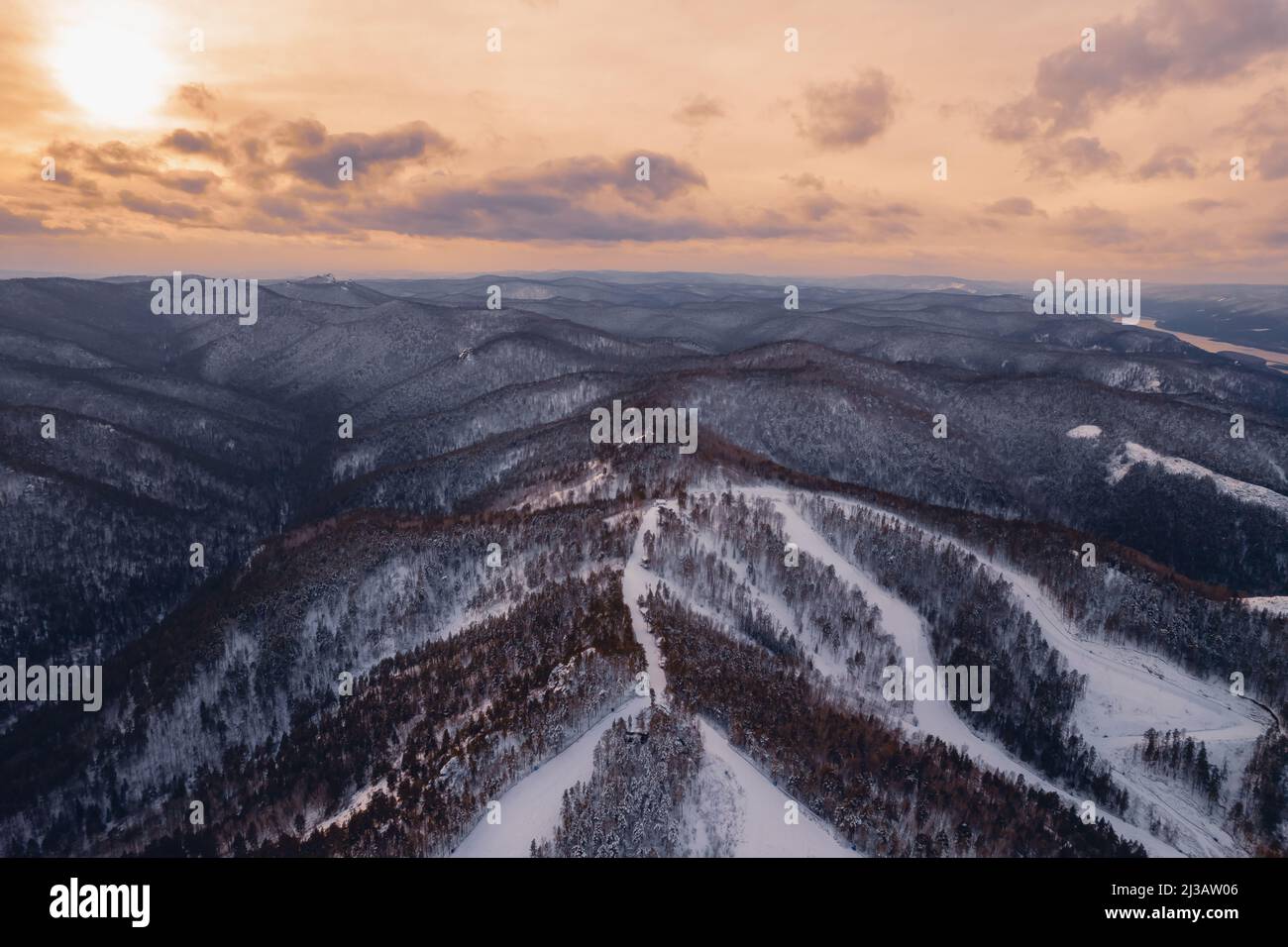 Aerial top view city Krasnoyarsk Russia taiga forest and rocks of stolby sanctuary, winter ...