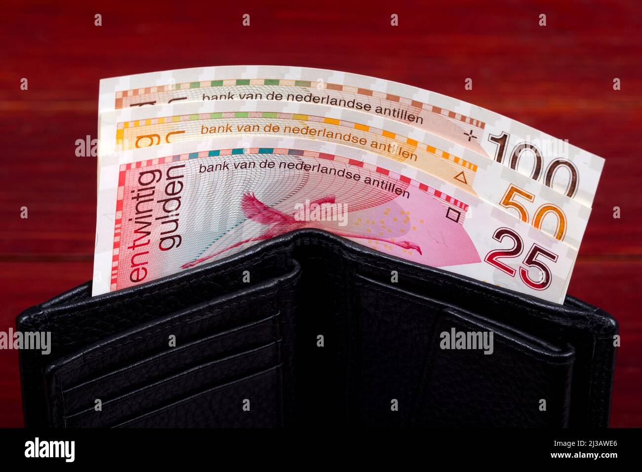 Netherlands Antillean money - guilder in the black wallet Stock Photo ...
