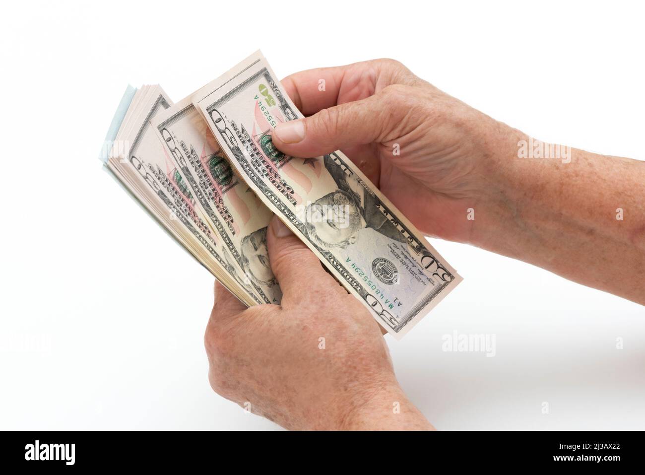 Hands counting us dollar bills hi-res stock photography and images - Alamy