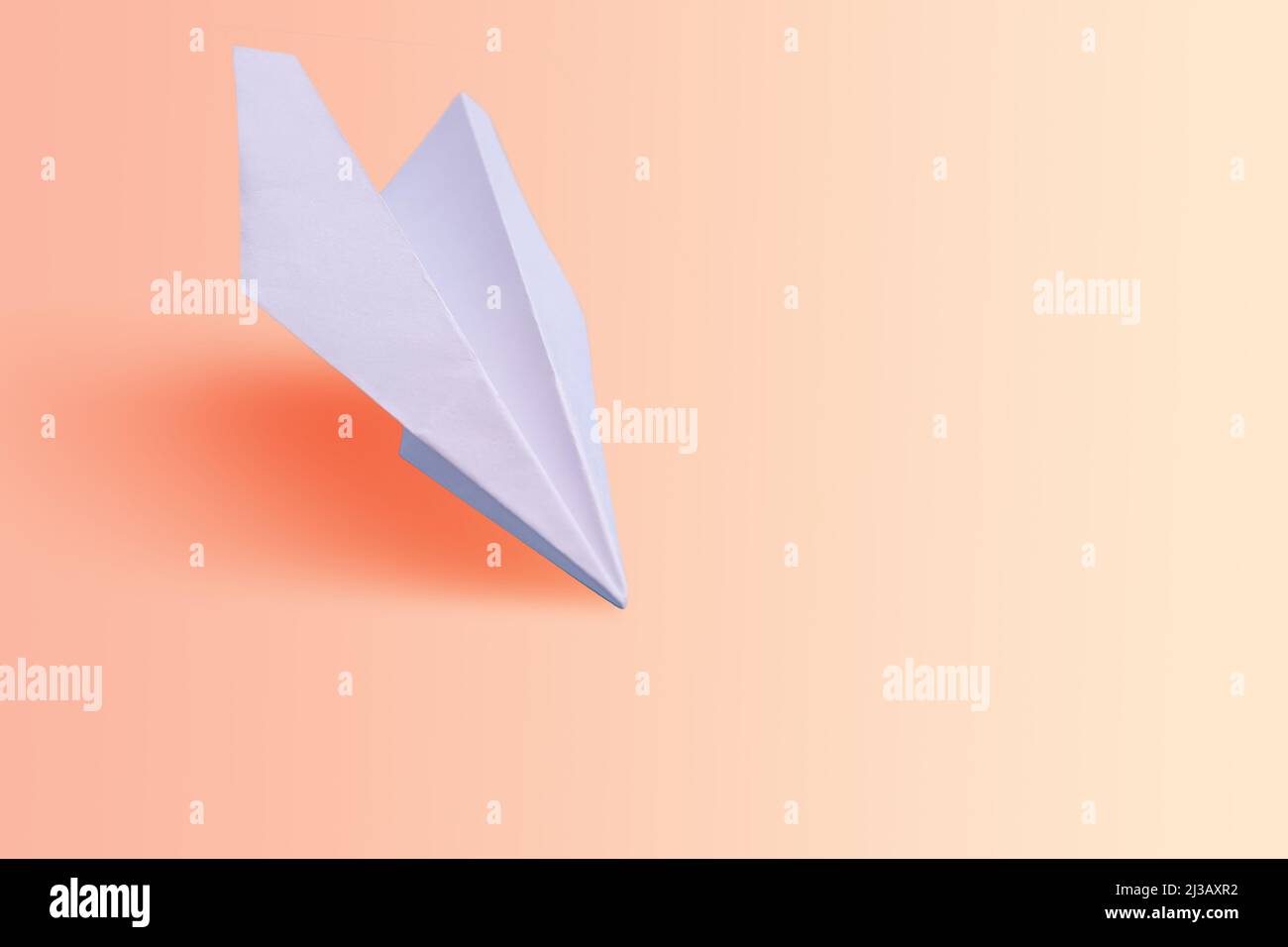 Paper airplane on a tone-harmonious background, toned Stock Photo - Alamy