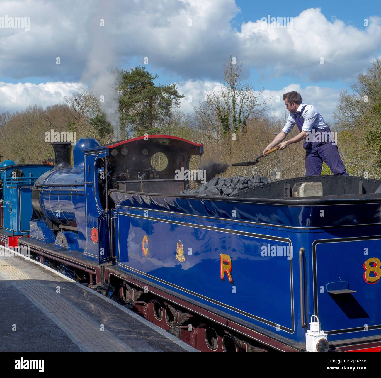 The fireman shovels coal forward on Caledonian Railway Class 812 0-6-0 ...