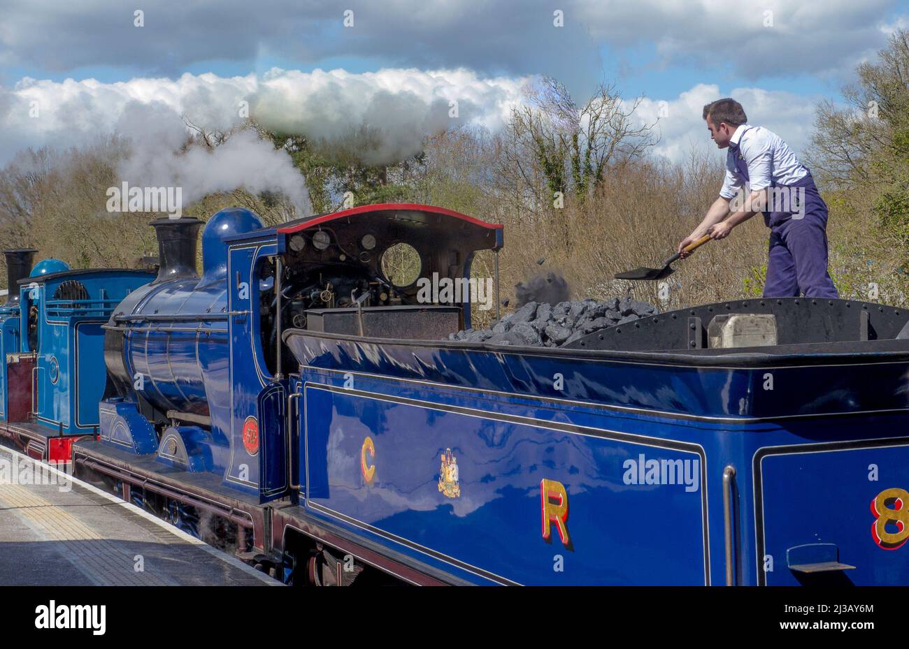 The fireman shovels coal forward on Caledonian Railway Class 812 0-6-0 ...