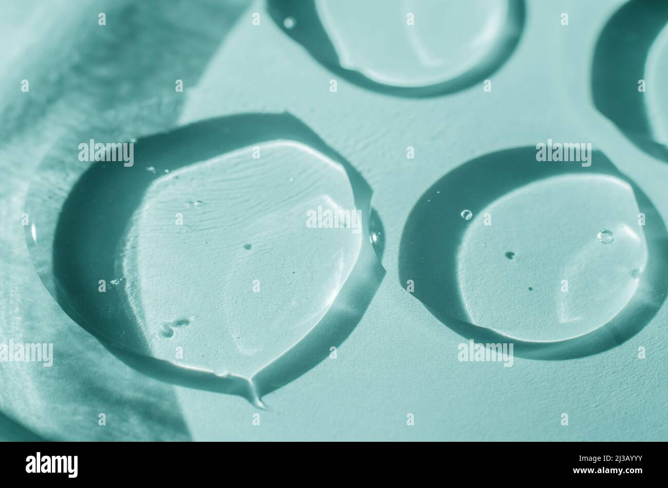 Close-up - the structure of the gel. Transparent cosmetic gel in a ...