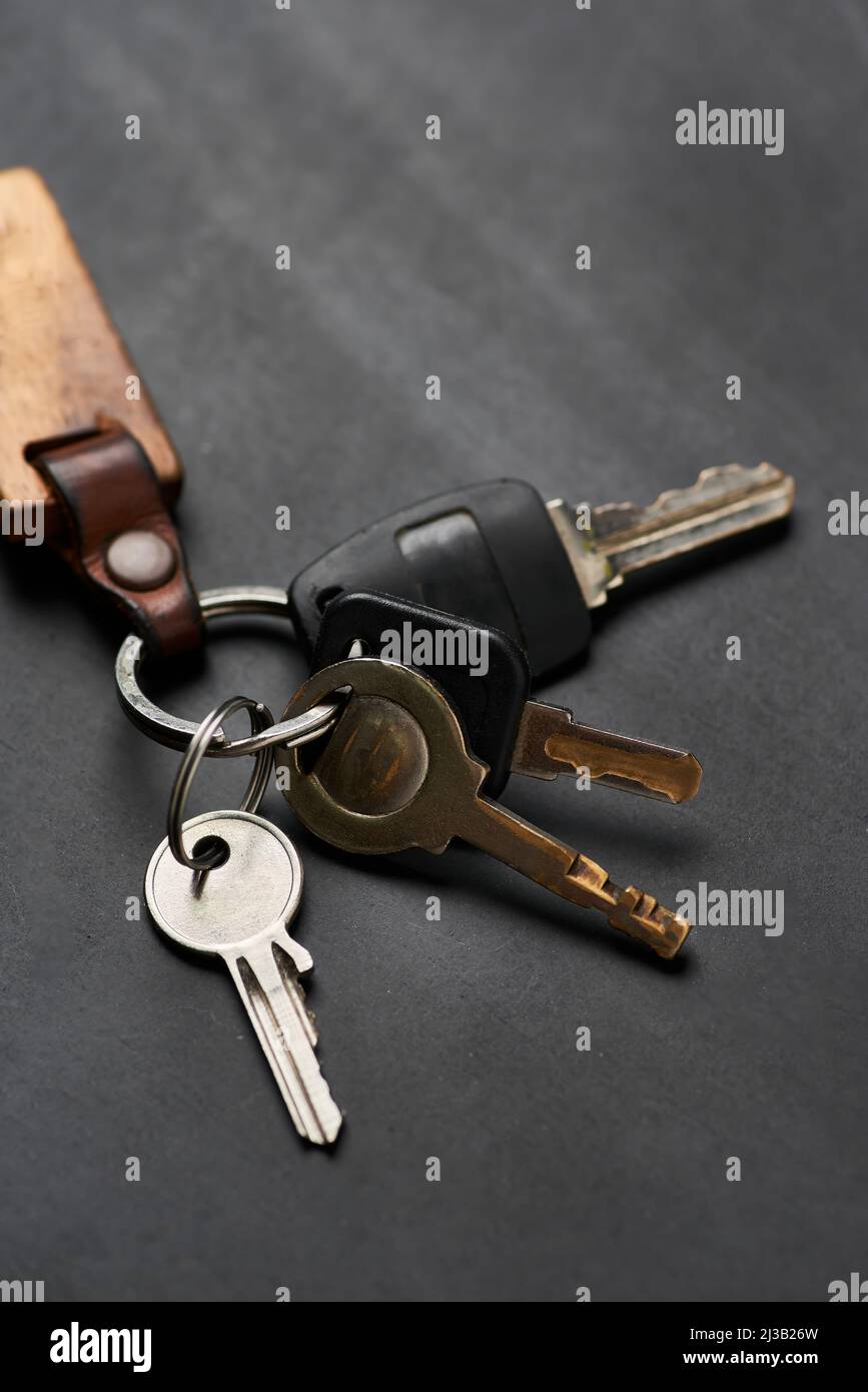 The bunch of keys on the black floor Stock Photo - Alamy
