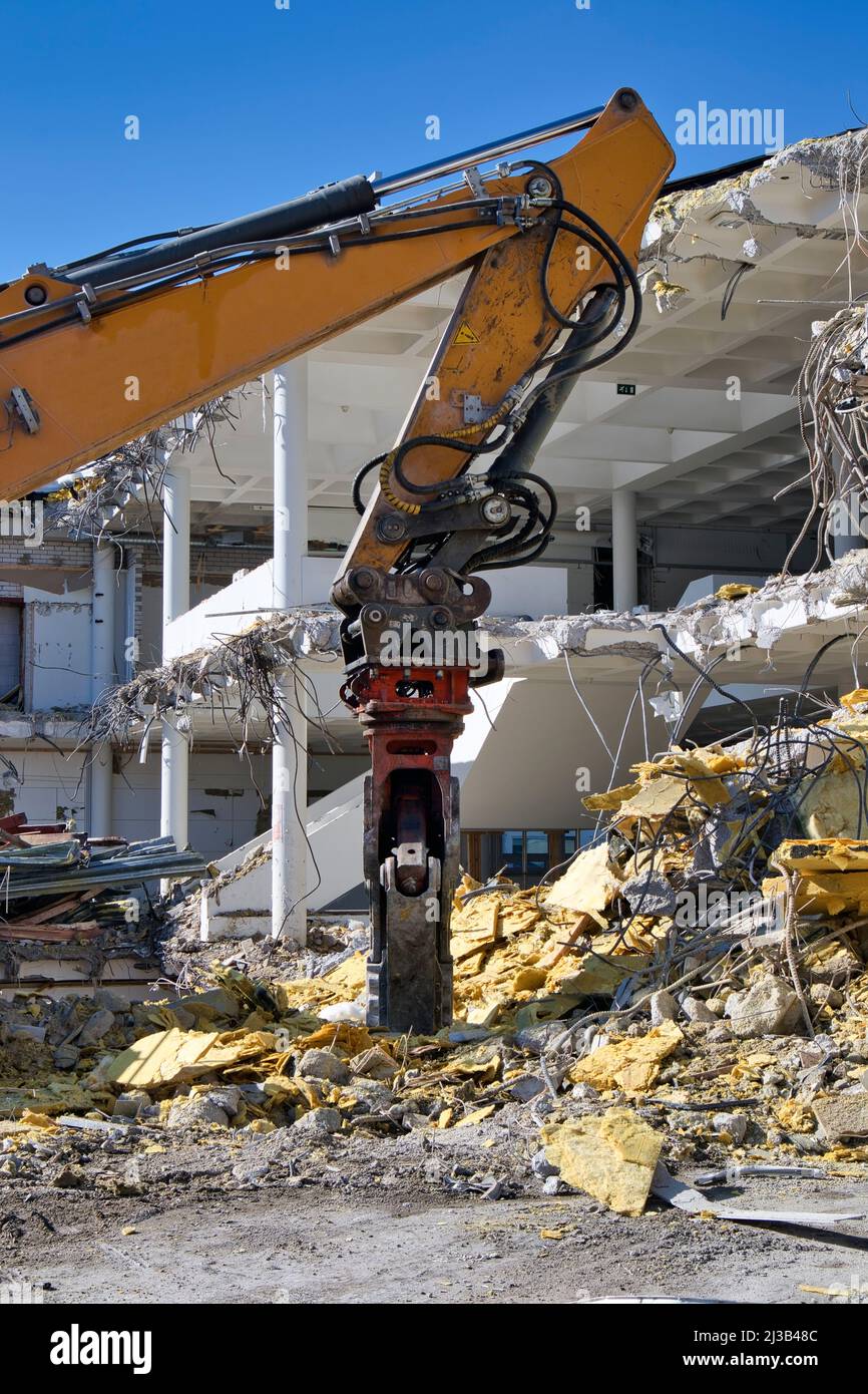 excavator machine at a demolition construction site Stock Photo - Alamy