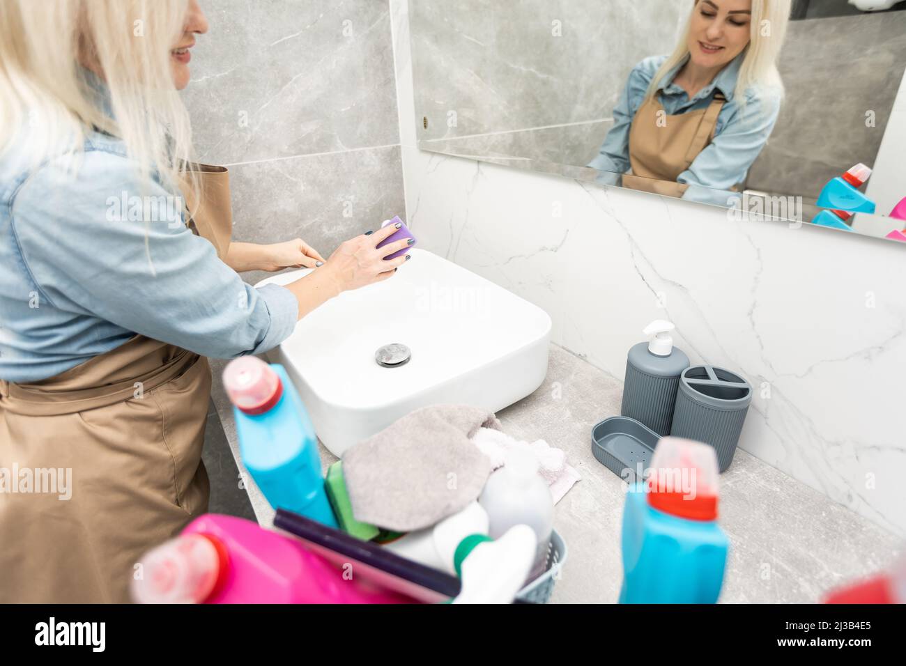 Woman cleaning the bathroom in her house Stock Photo - Alamy