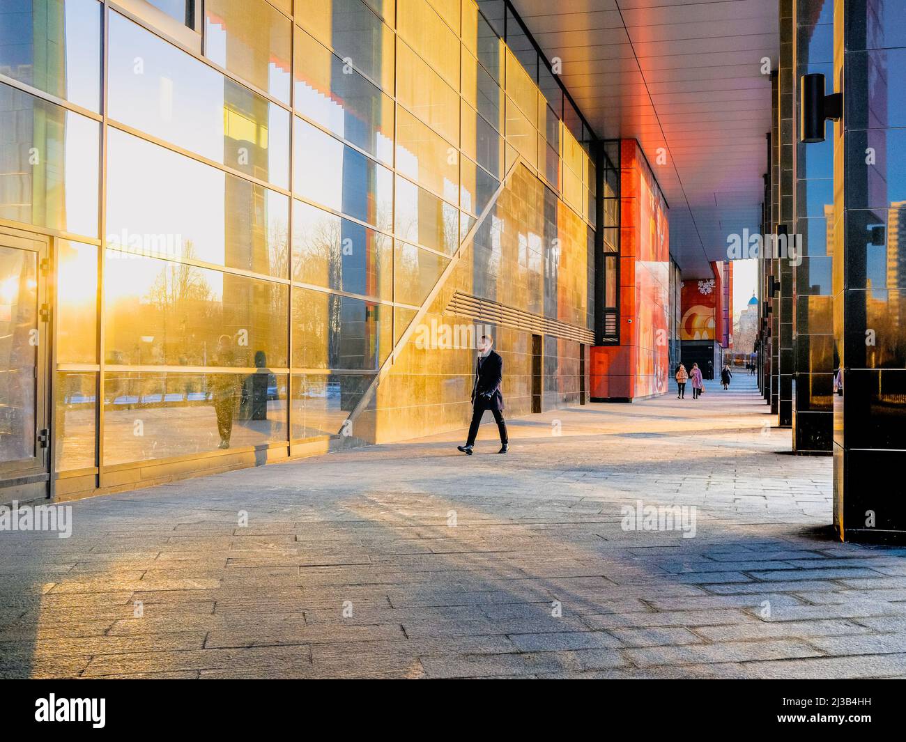 Moscow. Russia. March 22, 2022. People at the glass facade of the metro ...