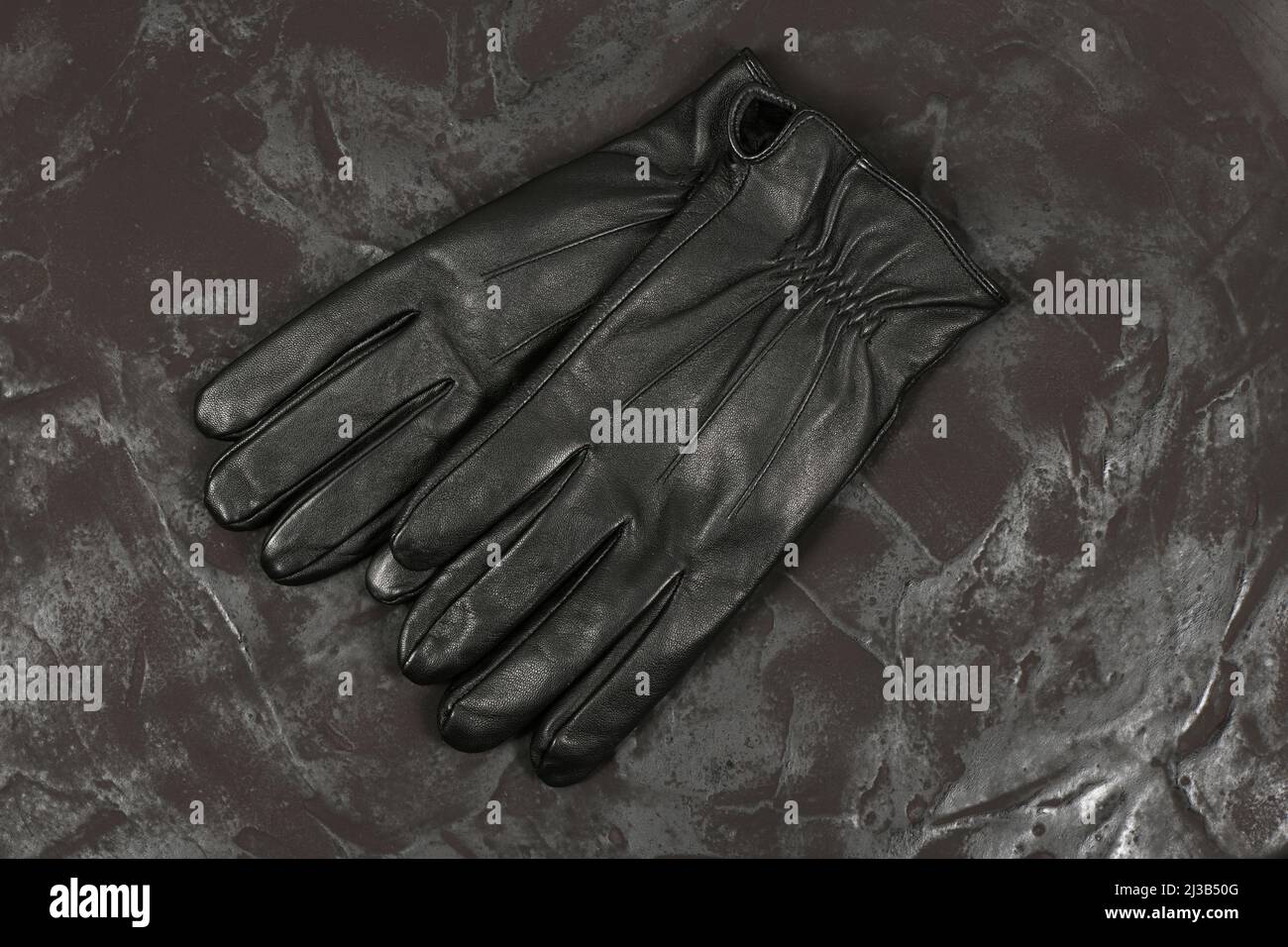 Casual leather gloves isolated on black background. Pair of gloves ...