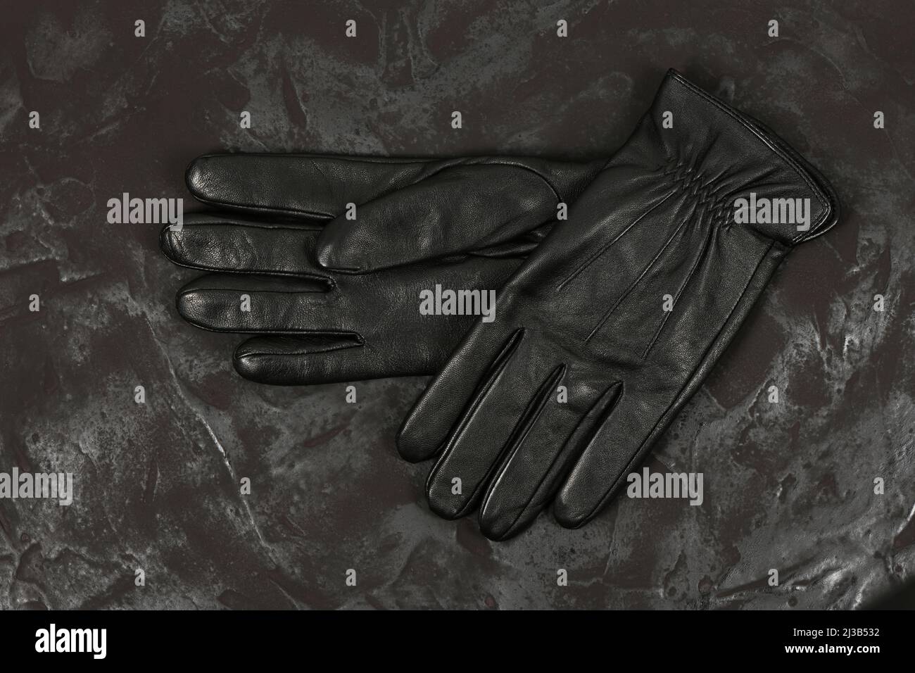 Casual leather gloves isolated on black background. Pair of gloves ...