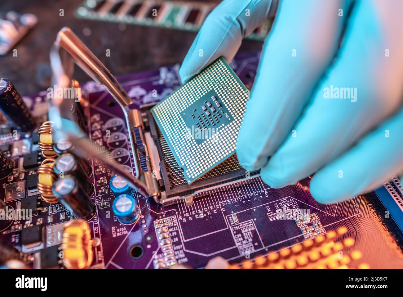 Engineer repairman holding hands in black gloves chip processor, CPU to ...