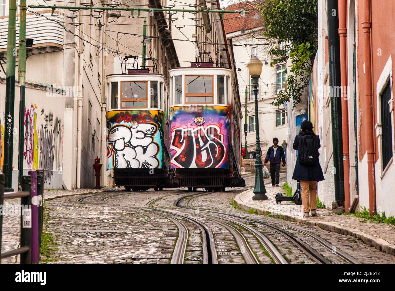 Lisbon, very steep Tram of Gloria Restauradores. Graffiti on the public ...
