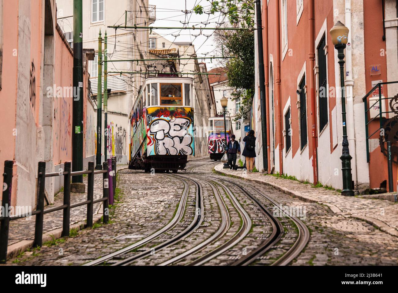 Lisbon, very steep Tram of Gloria Restauradores. Graffiti on the public ...