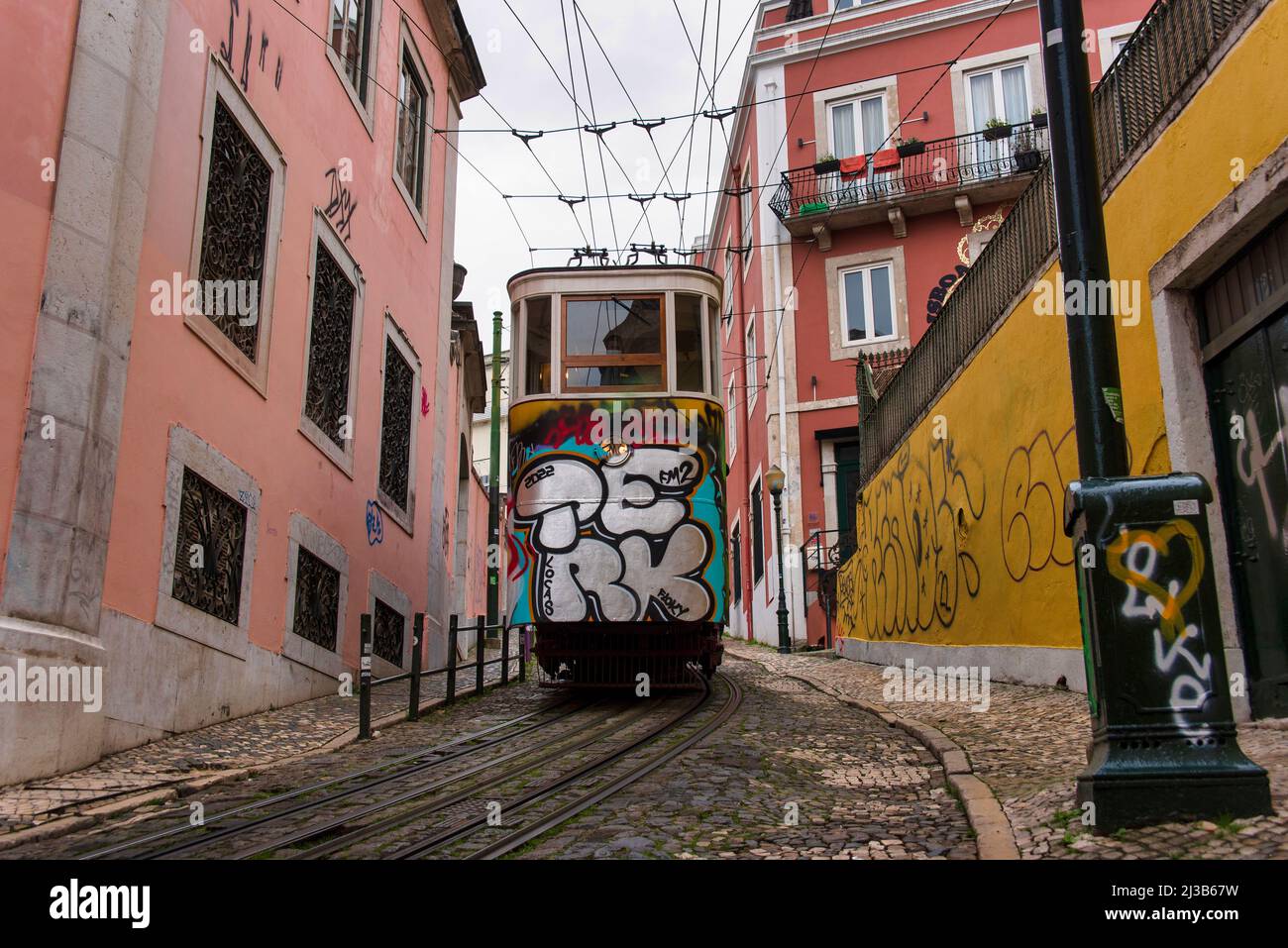 Lisbon, very steep Tram of Gloria Restauradores. Graffiti on the public ...