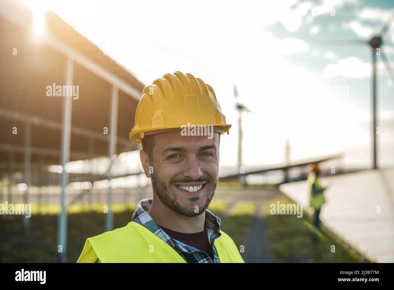 People working for solar panels and wind turbines - Renewable energy ...
