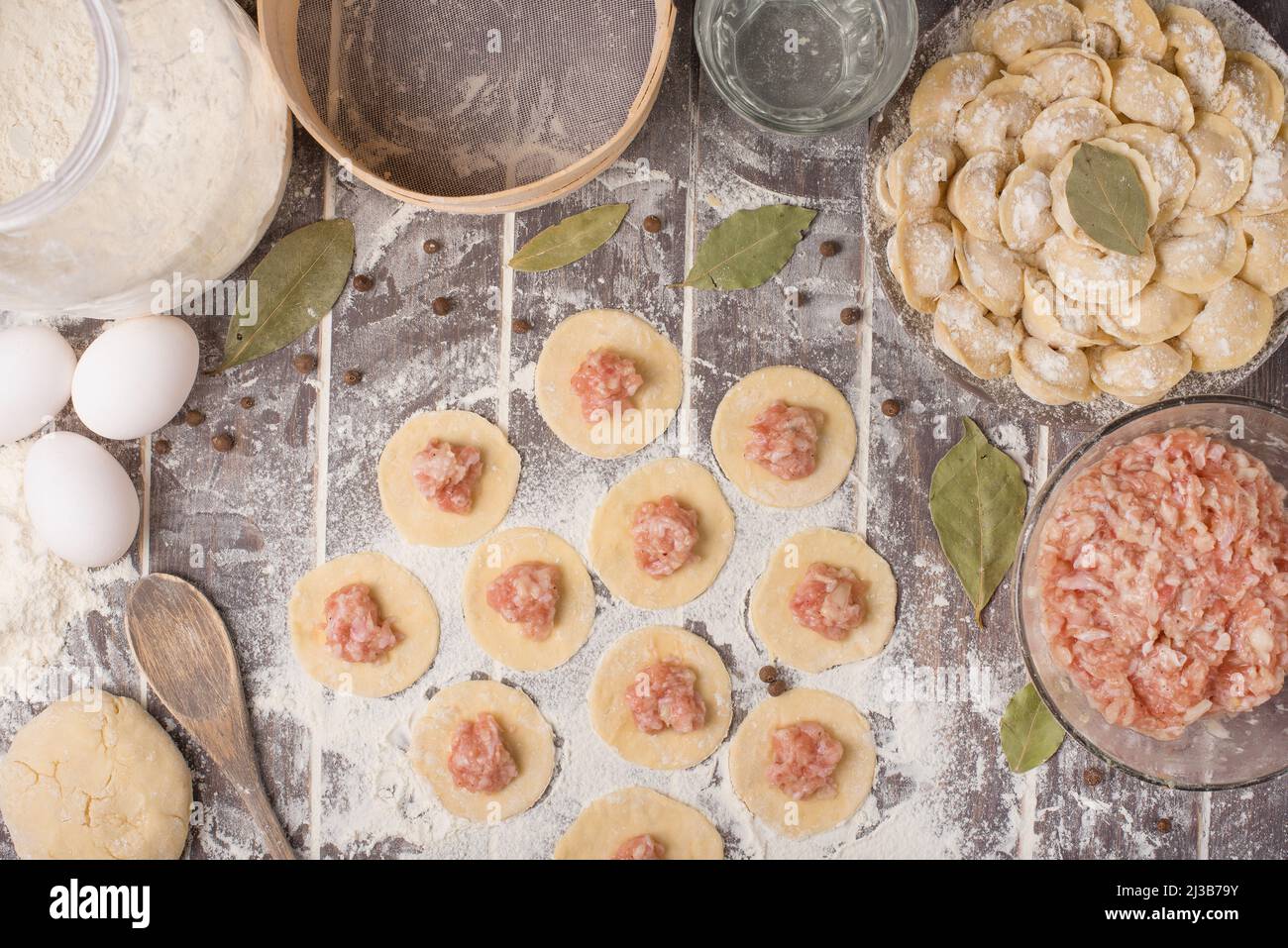process of cooking pelmeni with chef's hands, top view Stock Photo - Alamy