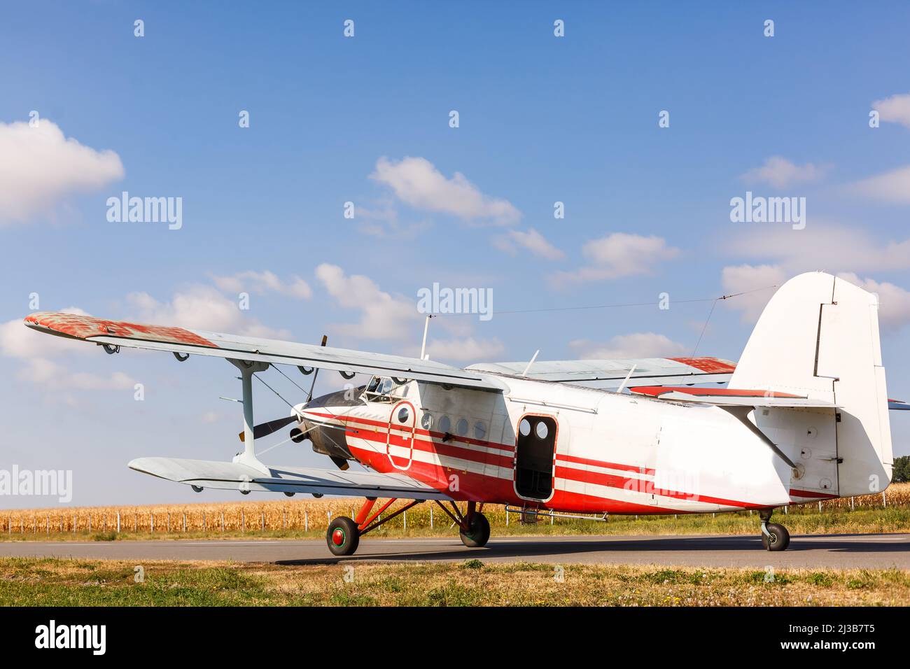 Small light airplane ready to flight on the airport field Stock Photo ...