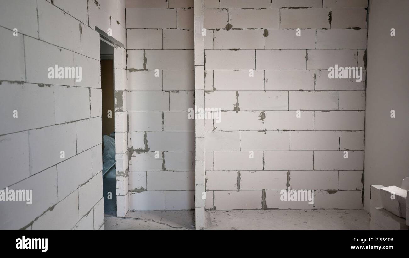 Finished wall of aerated concrete blocks in a new apartment. View of an ...