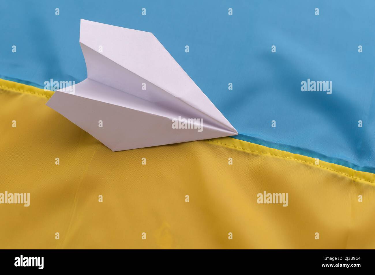 paper airplane on the background of the flag of Ukraine Stock Photo - Alamy