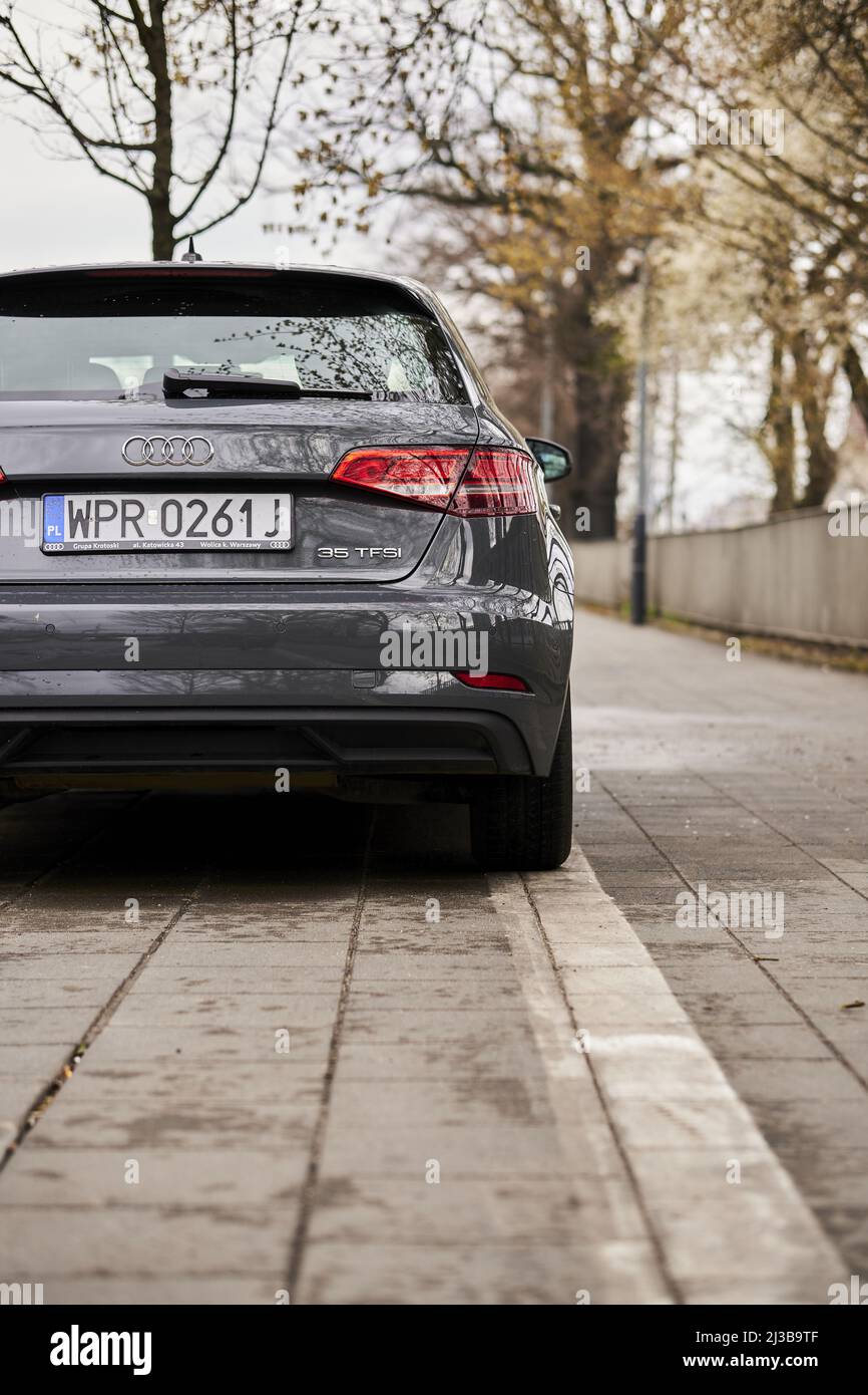 Back of a parked new modern Audi car by a sidewalk in the city Stock ...