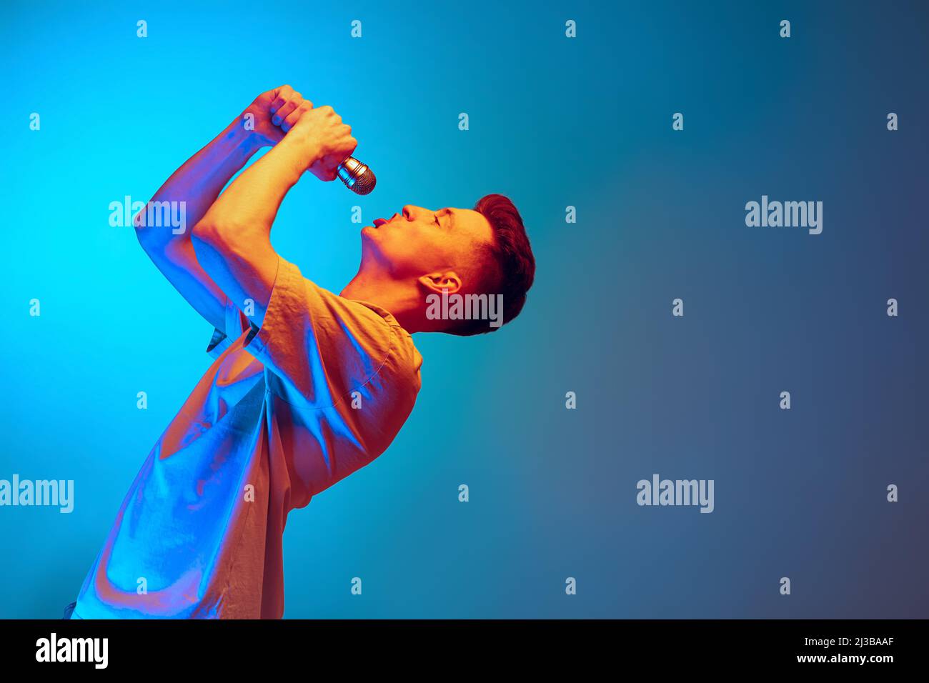 Musician, singer. Studio shot of young emotional man, student posing ...