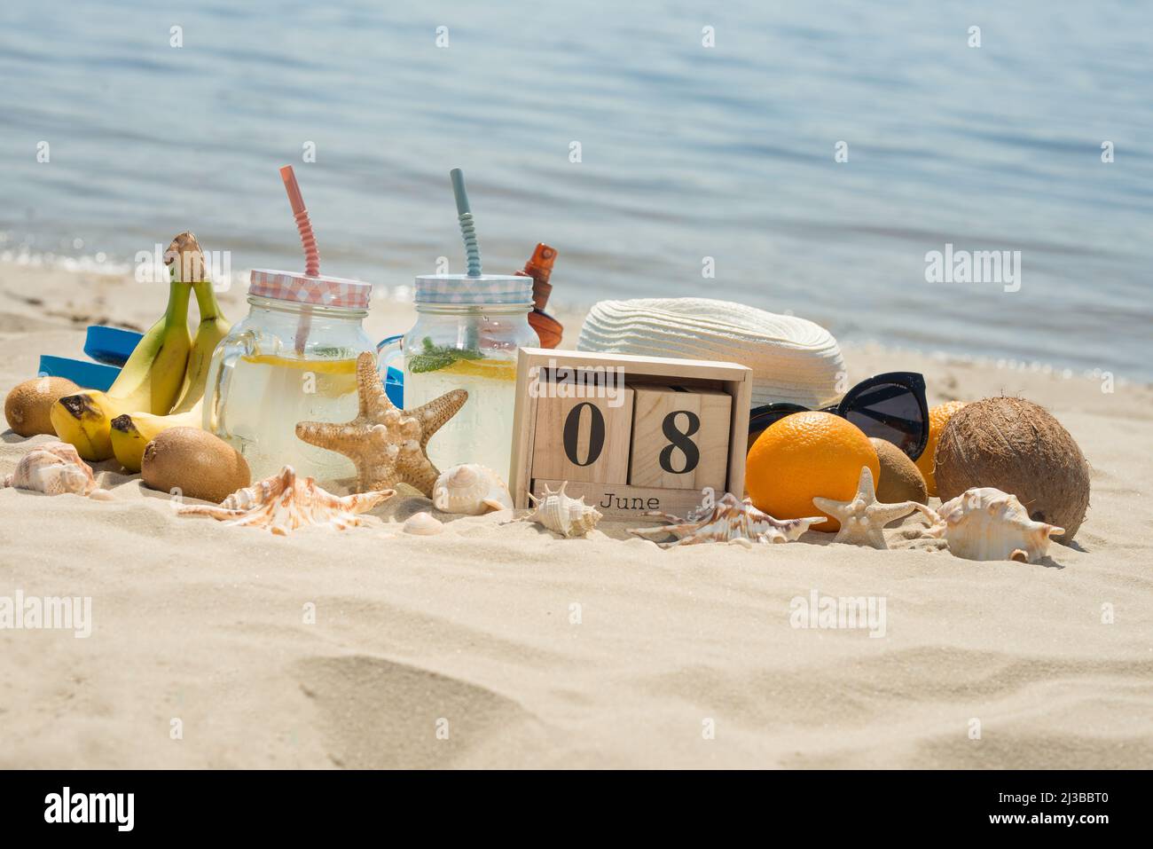 Calendares on June 8 on the shore of the ocean with seashells, the ...