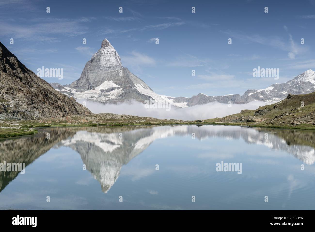 A wallpaper of Matterhorn and reflection on the lake Stock Photo - Alamy